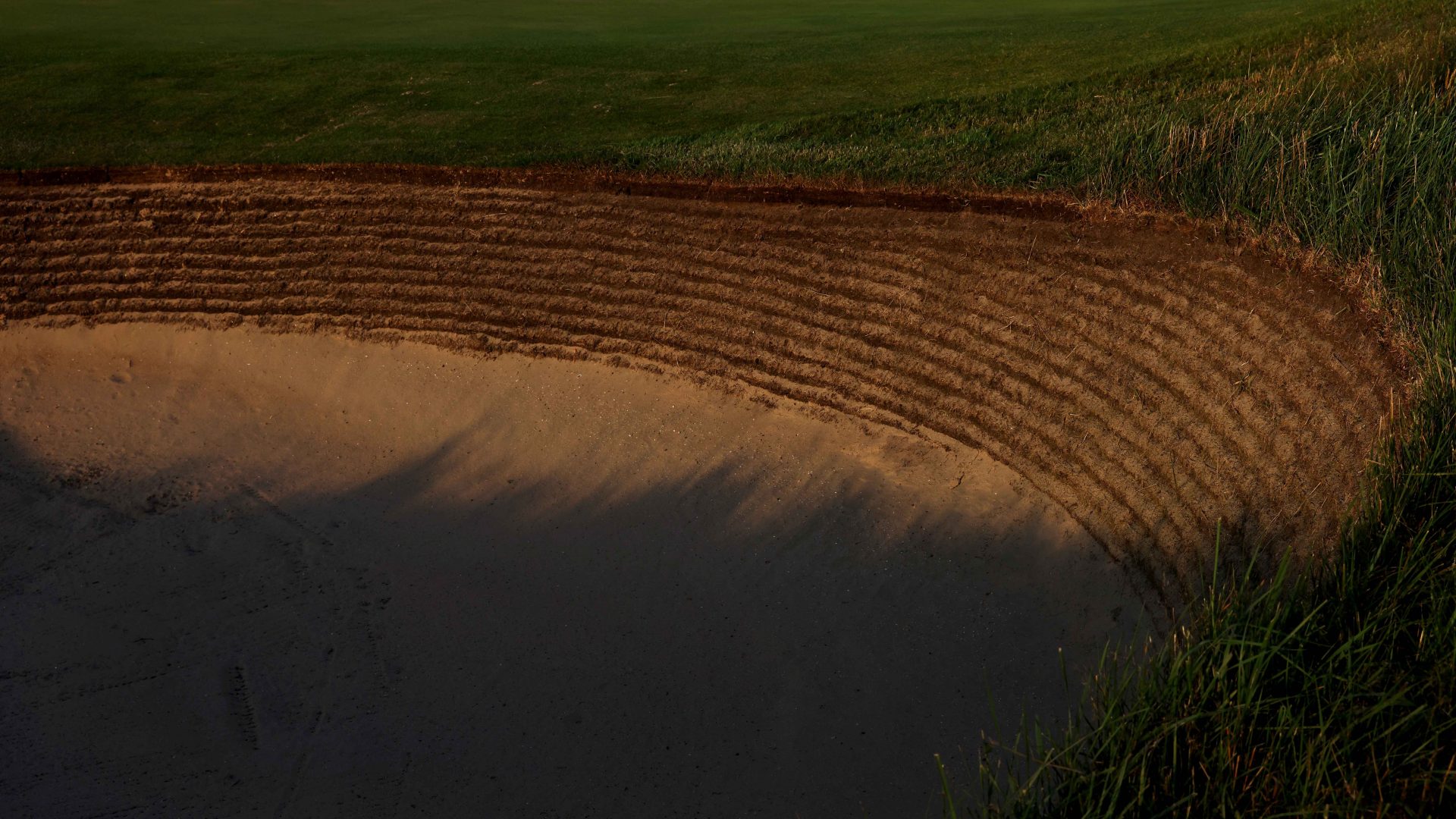 They do things a bit differently at The Open – even raking bunkers ...