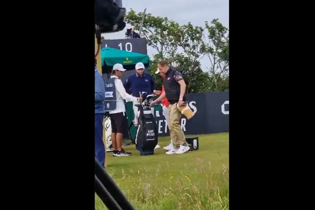 Bizarre scenes as spectator helps himself to Rory McIlroy's clubs on ...